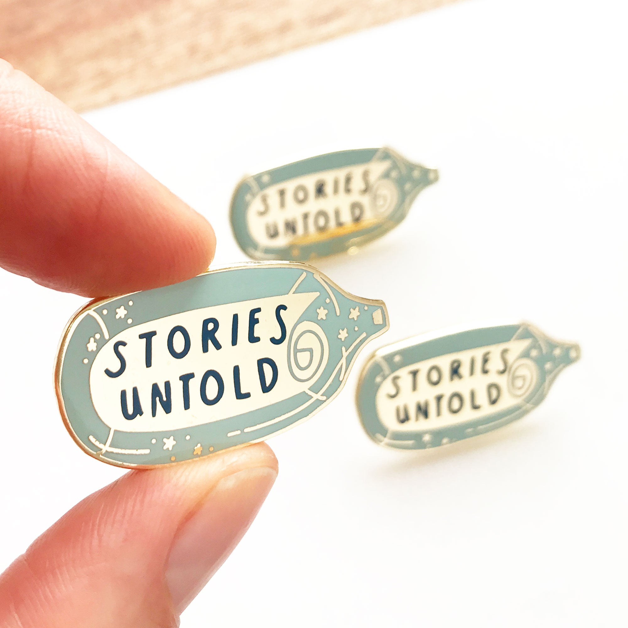 'Stories Untold' · Illustrated Enamel Pin Badge · Limited Edition